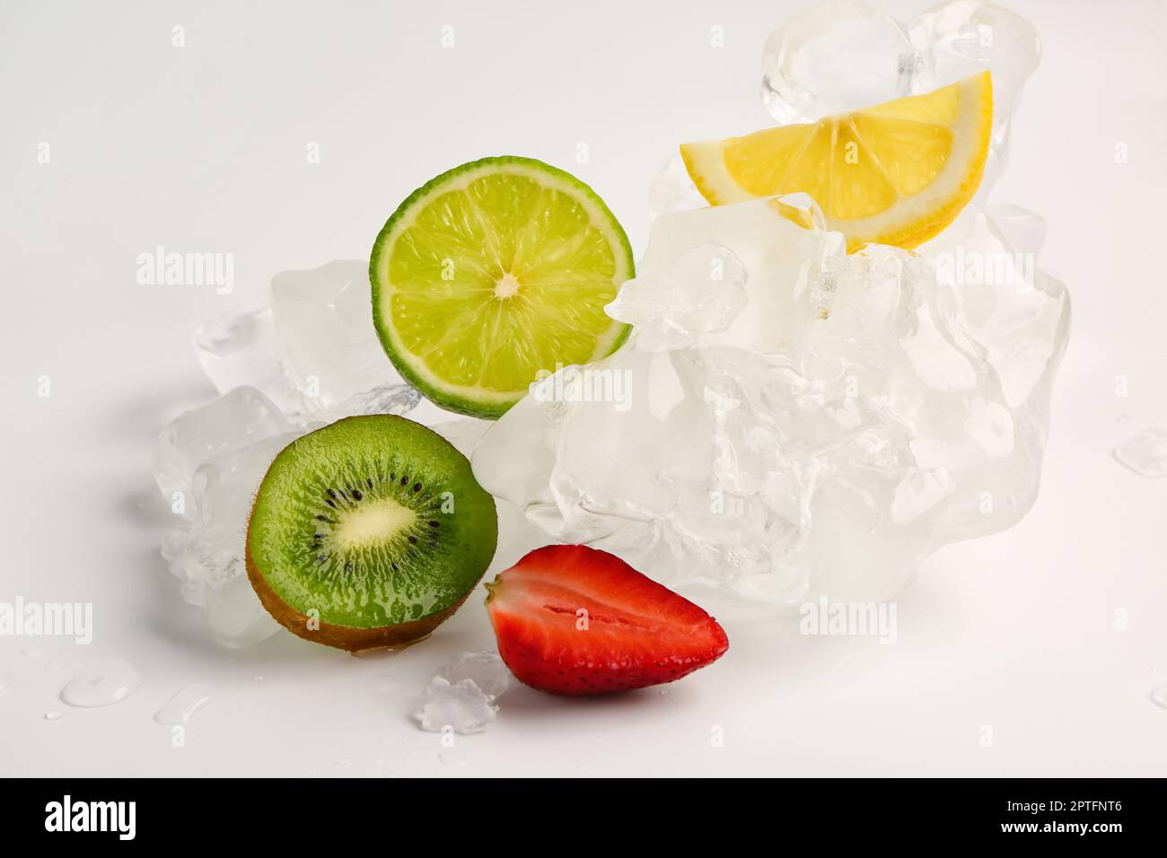 Sliced fresh fruits and ice isolated on white background Stock Photo ...