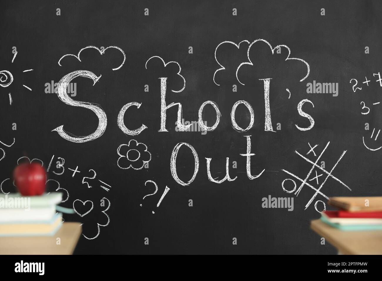 Text SCHOOL'S OUT with drawings on blackboard in classroom Stock Photo ...