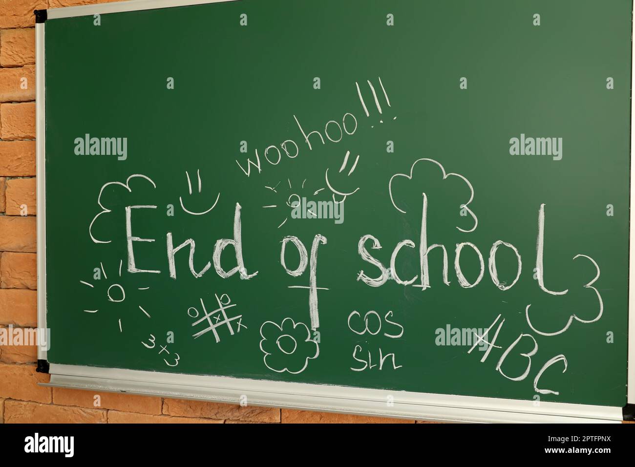 Blackboard with text END OF SCHOOL and drawings on brick wall Stock ...