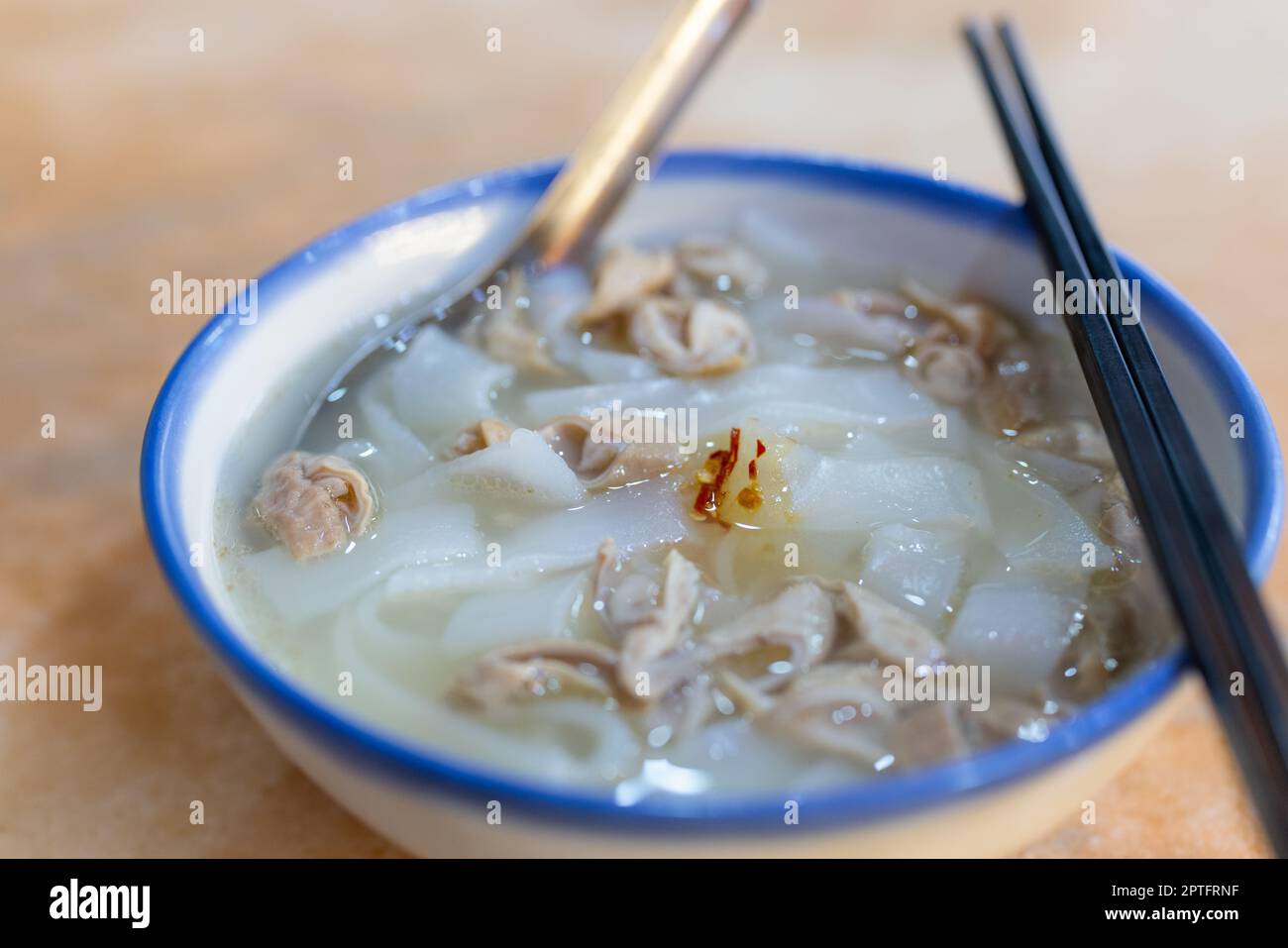 Pork intestine rice flat noodle in restaurant Stock Photo - Alamy
