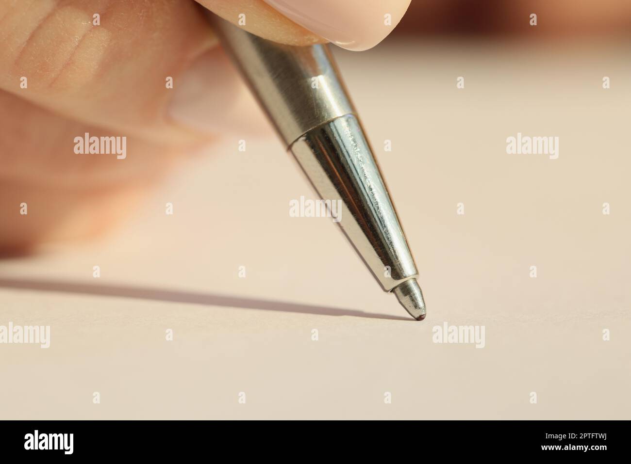 Hand of woman holding iron ball-pen ready to write notes Stock Photo ...