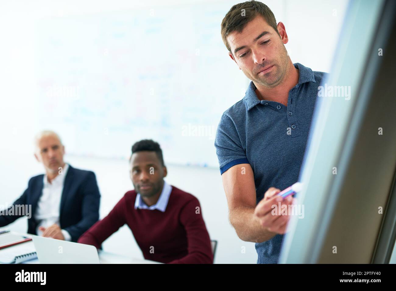 Focus your attention here for a minute...a young businessman giving a ...