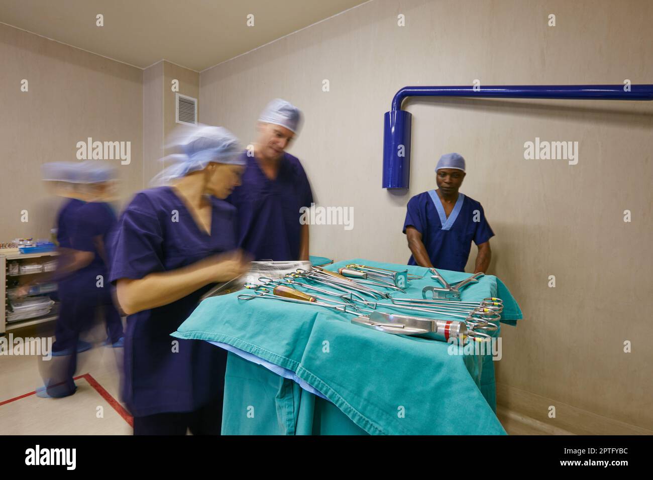 Working together to prep the operating room. a team of surgeons ...
