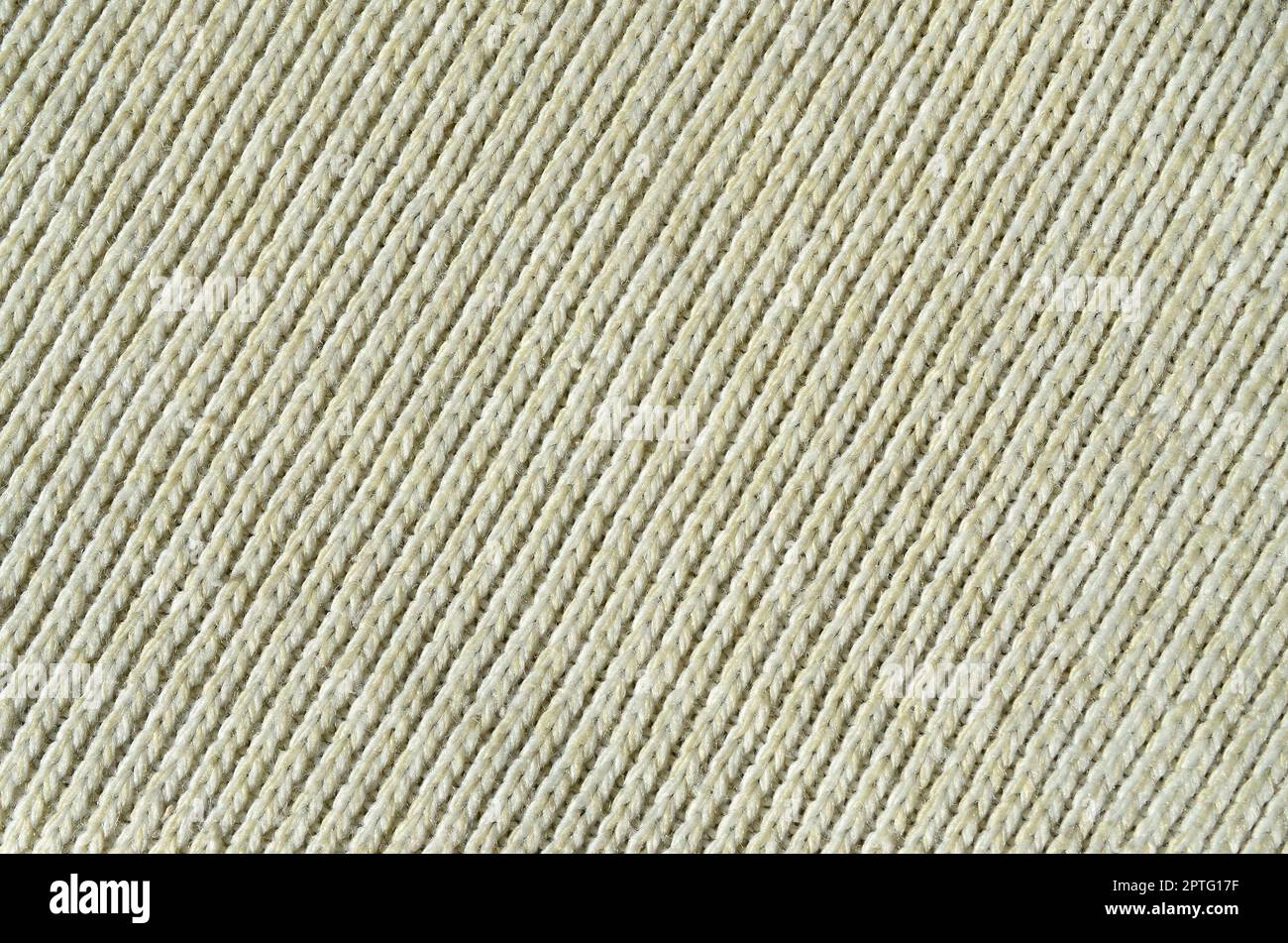 Fabric texture of a soft yellow knitted sweater. Macro image of the ...