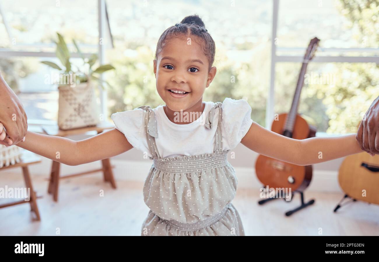 Girl in living room, portrait of kid holding hands for family support ...