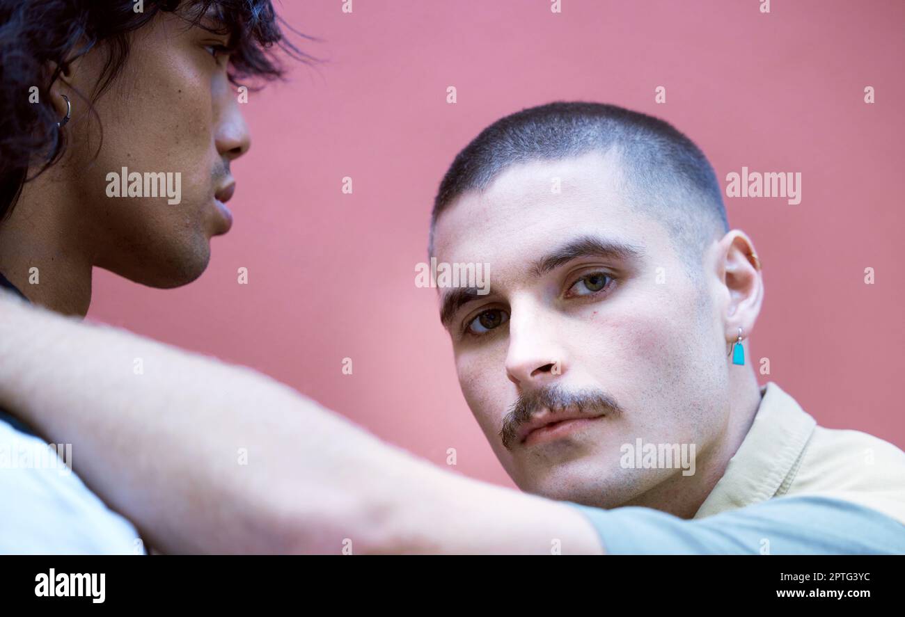 Portrait, diversity and fashion men outdoor against a wall space ...