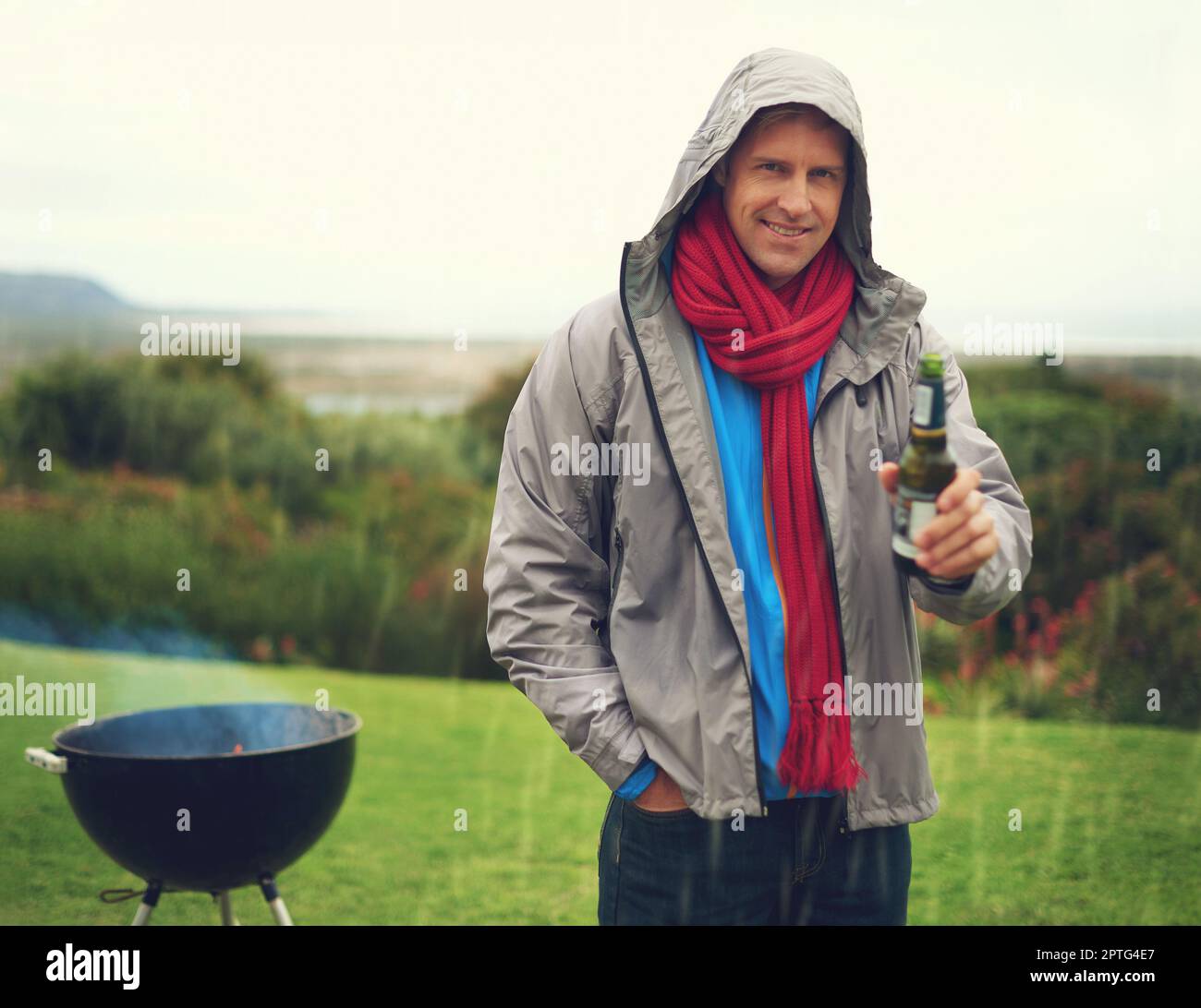 Beer and braaing is one of the best combos ever. a cheerful man ...
