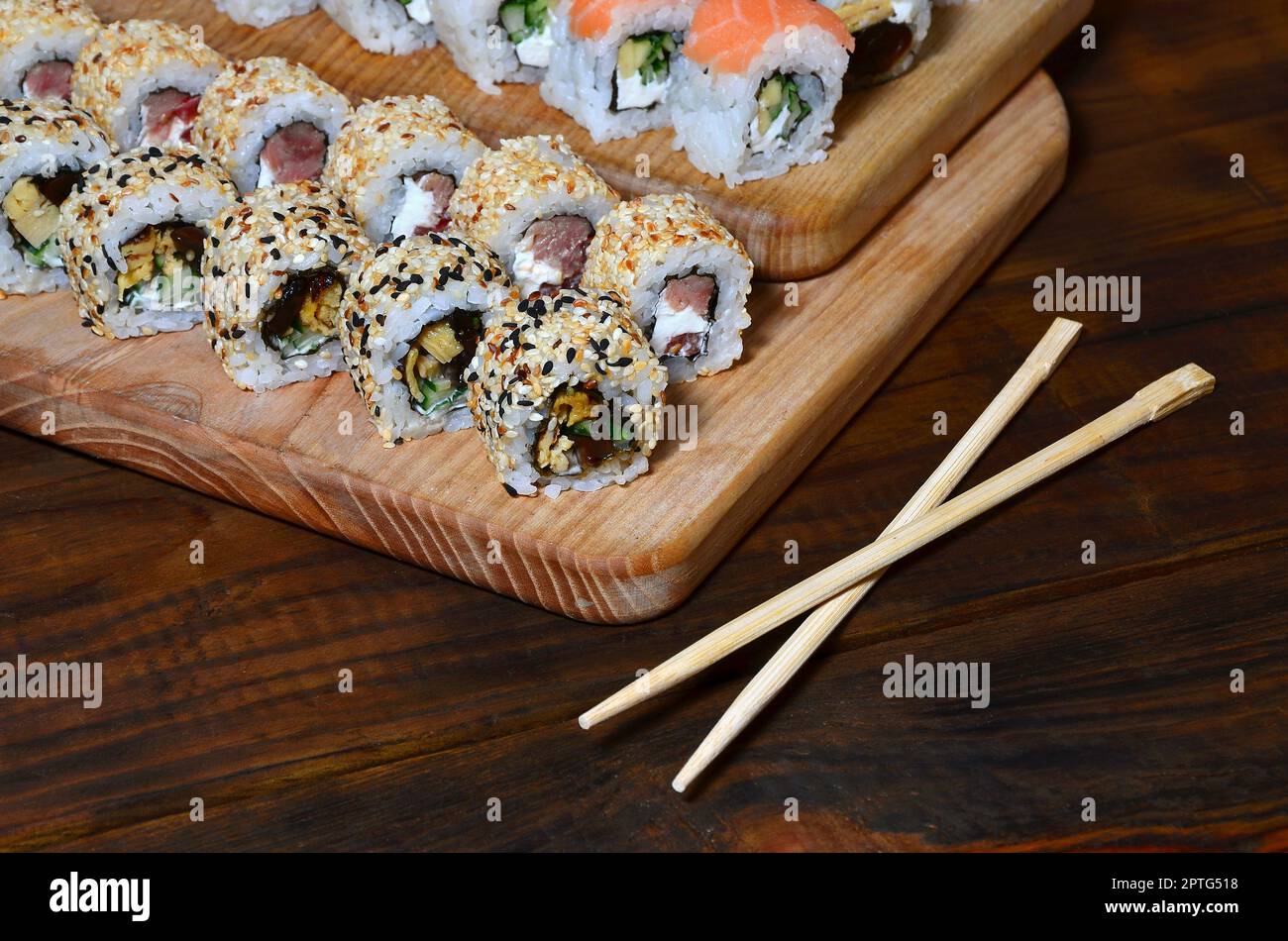 A detailed shot of a set of Japanese sushi rolls and a device for their ...