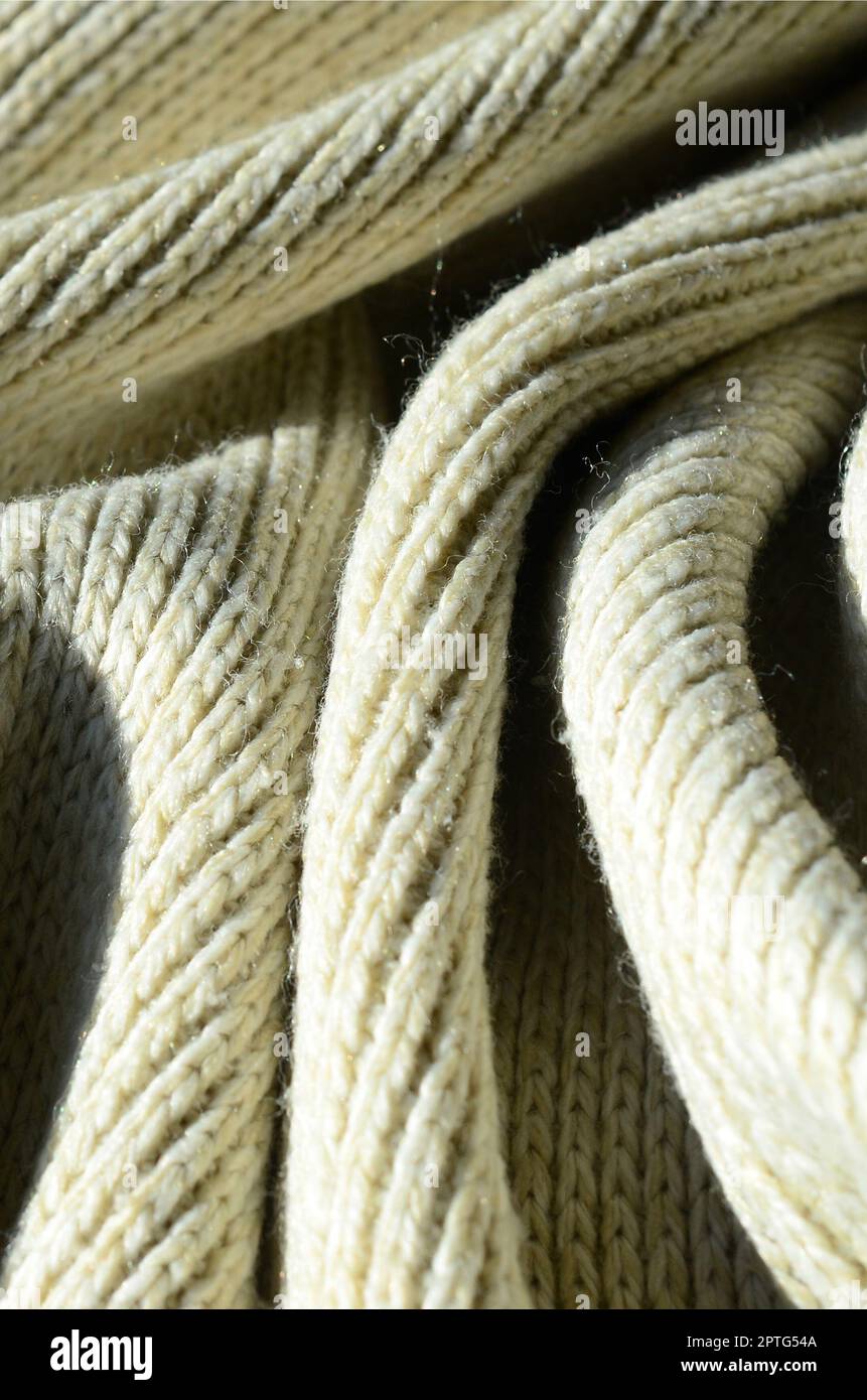 Fabric texture of a soft yellow knitted sweater. Macro image of the ...