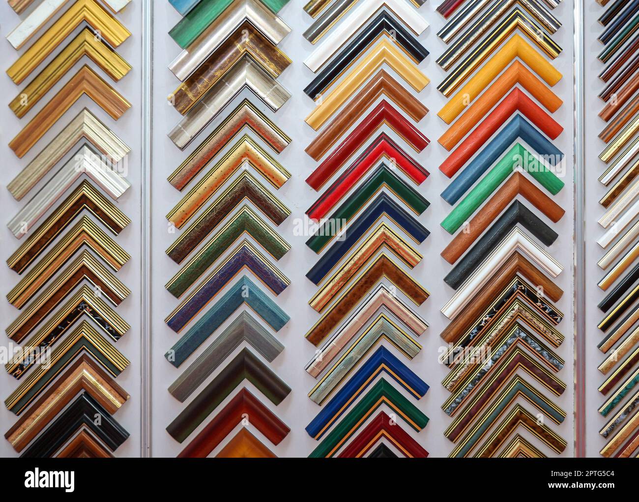 Modern colorful shiny wooden frames corners samples on wall in showroom ...