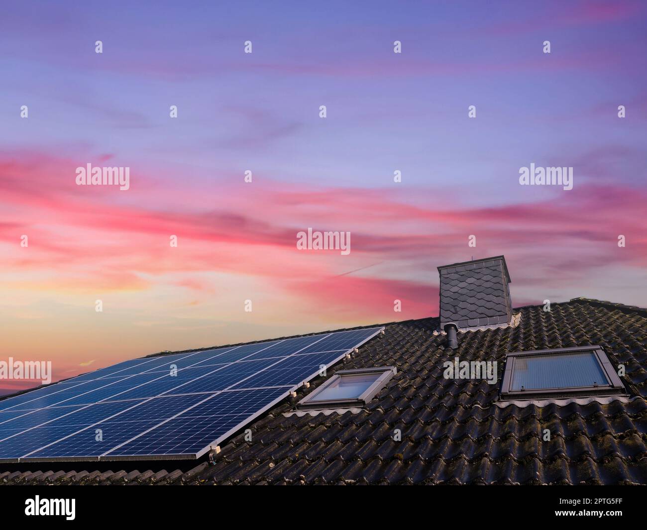 Solar panels producing clean energy on a roof of a residential house ...