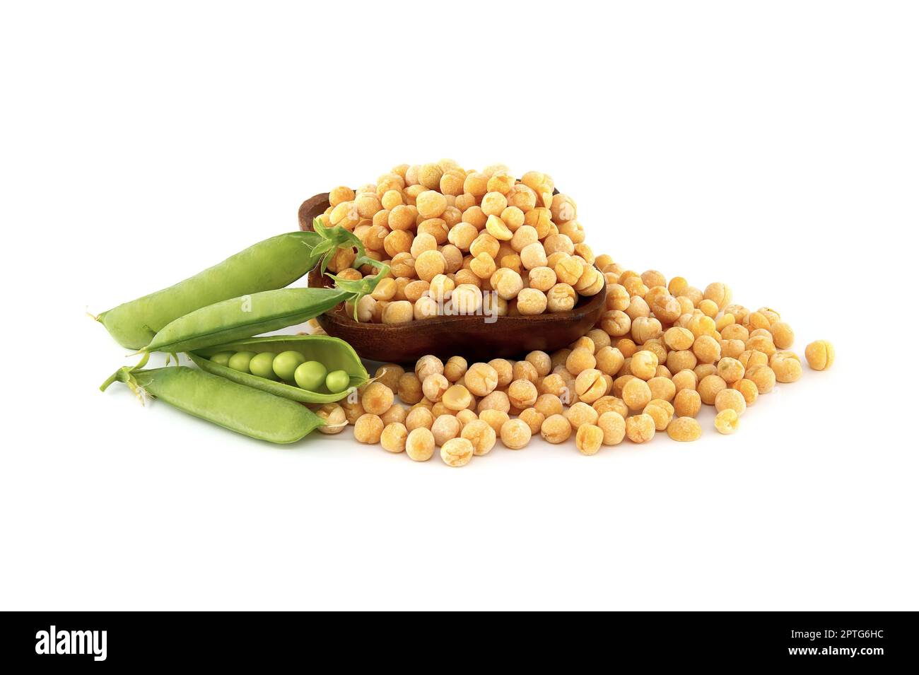 Dry whole yellow peas and sweet green peas with green leaves on white ...