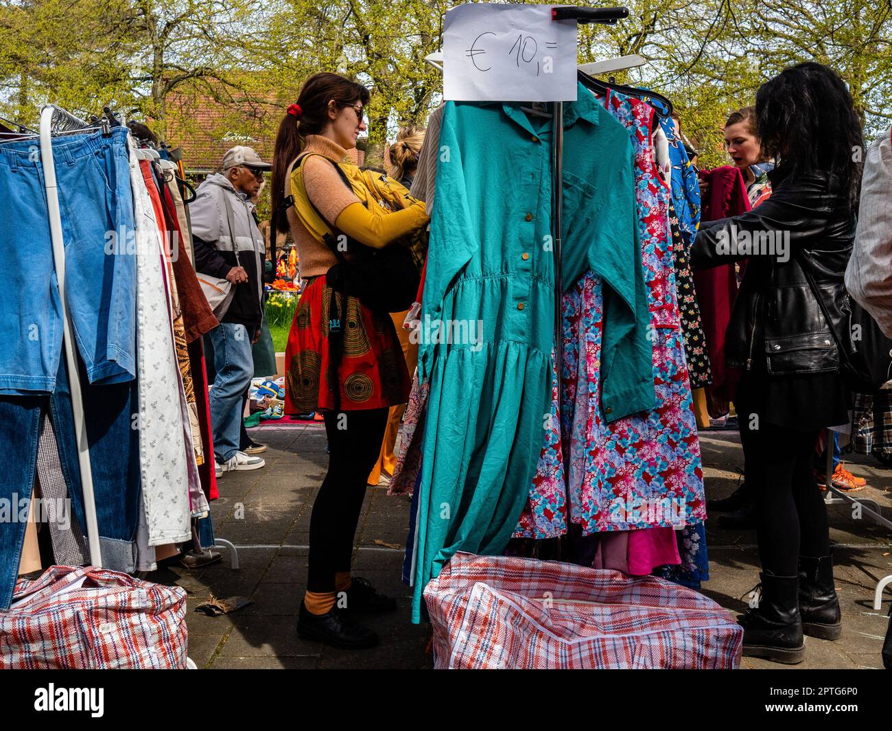 Amsterdam, Netherlands. 27th Apr, 2023. Two women are seen checking ...