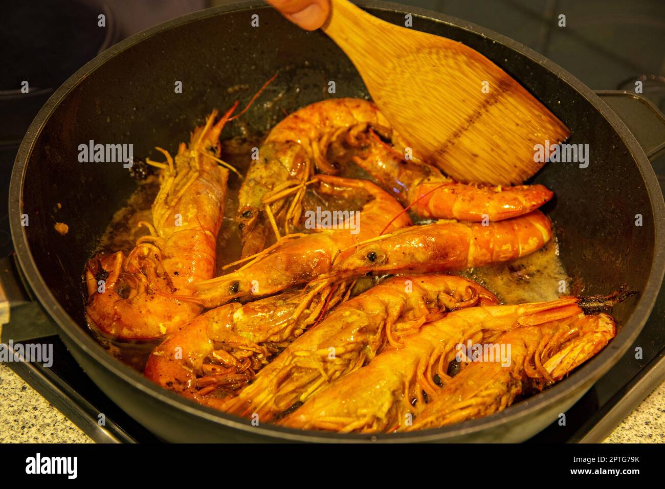 Argentinian red prawns. The argentine red fried shrimps in a pan and a ...