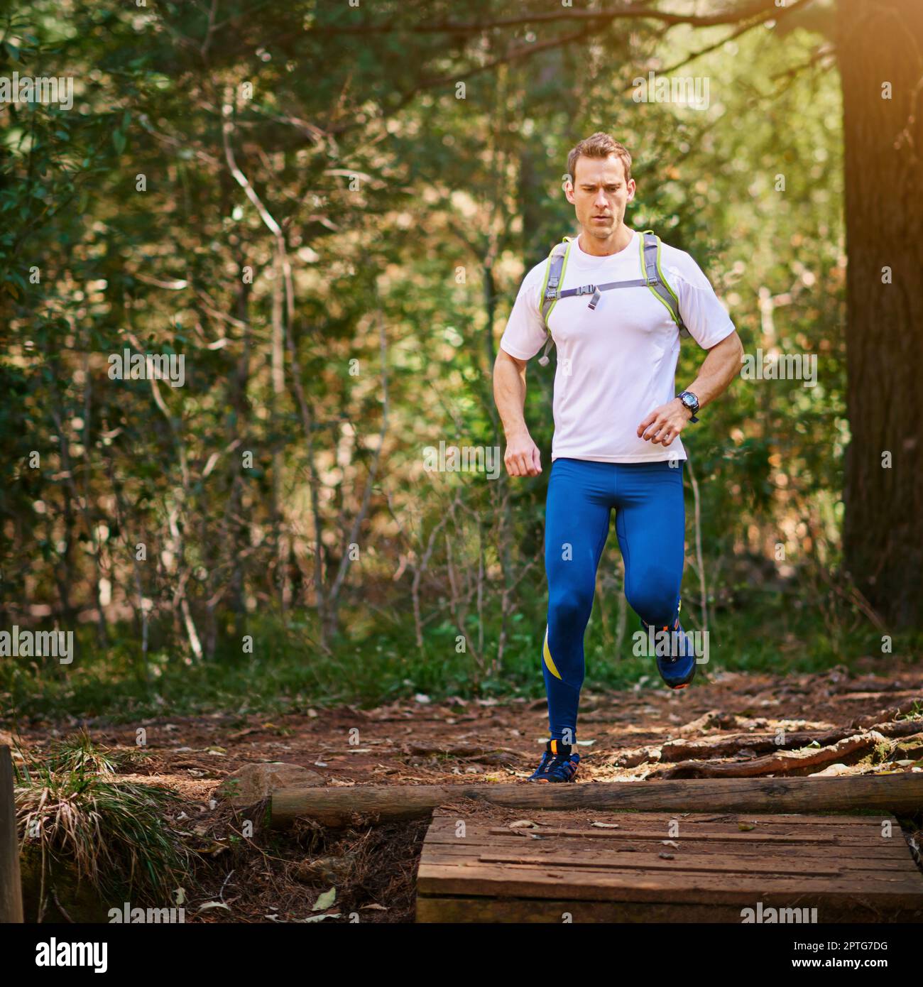 Trail running- the perfect way to escape city life. a young man running ...