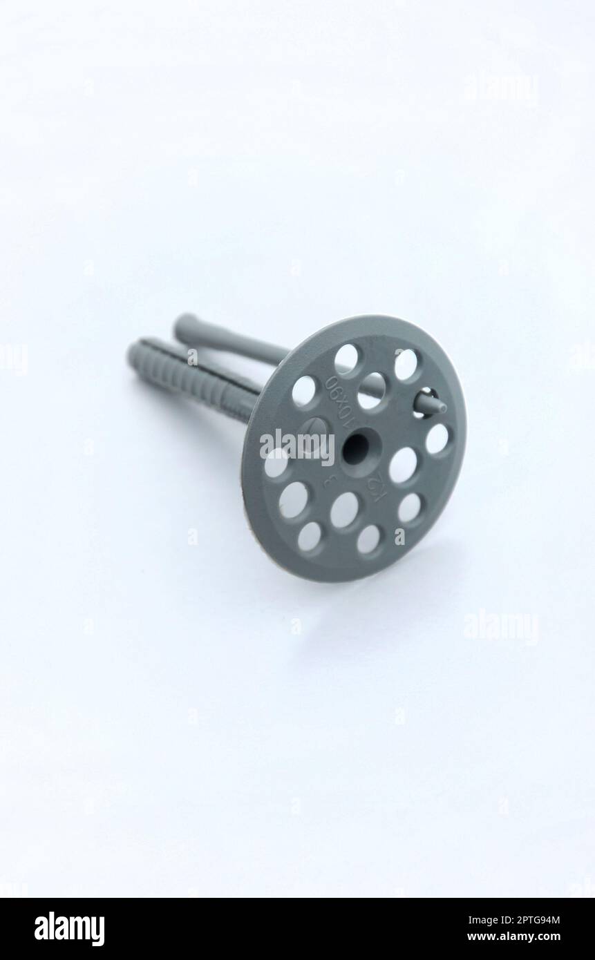 A gray plastic dowel (fastening) for thermal insulation with round ...