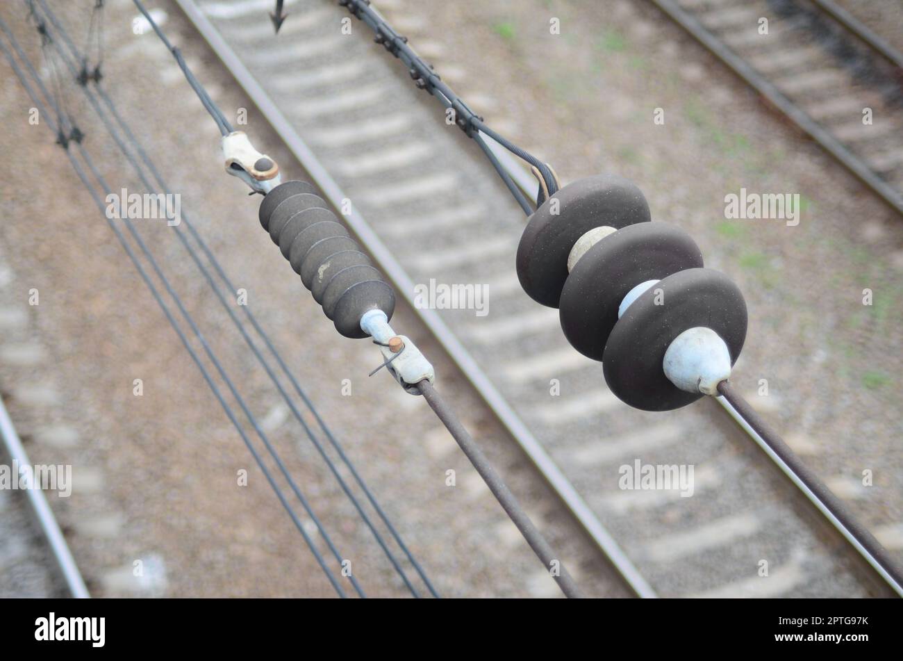 Electrical insulators on the contact wires on the background of a ...