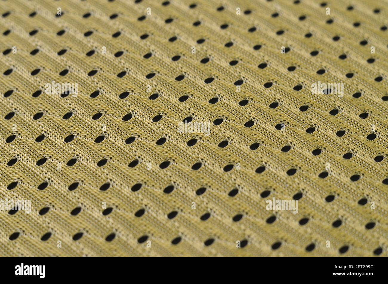 Background image of a fabric texture of a yellow jersey made of ...