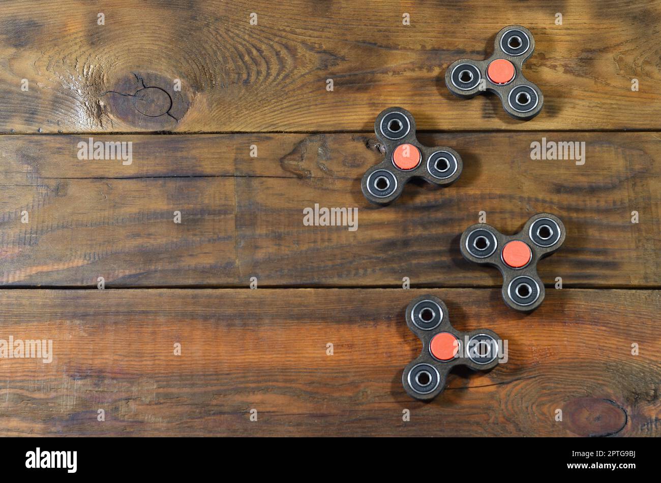 Popular finger spinner device. Modern fidget spinning toy on bearings ...