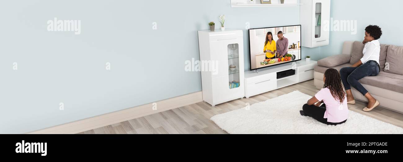 Mom watching movie in tv hi-res stock photography and images - Alamy