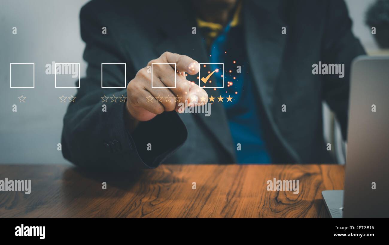 Business people use laptop computers survey and rate satisfaction give ...