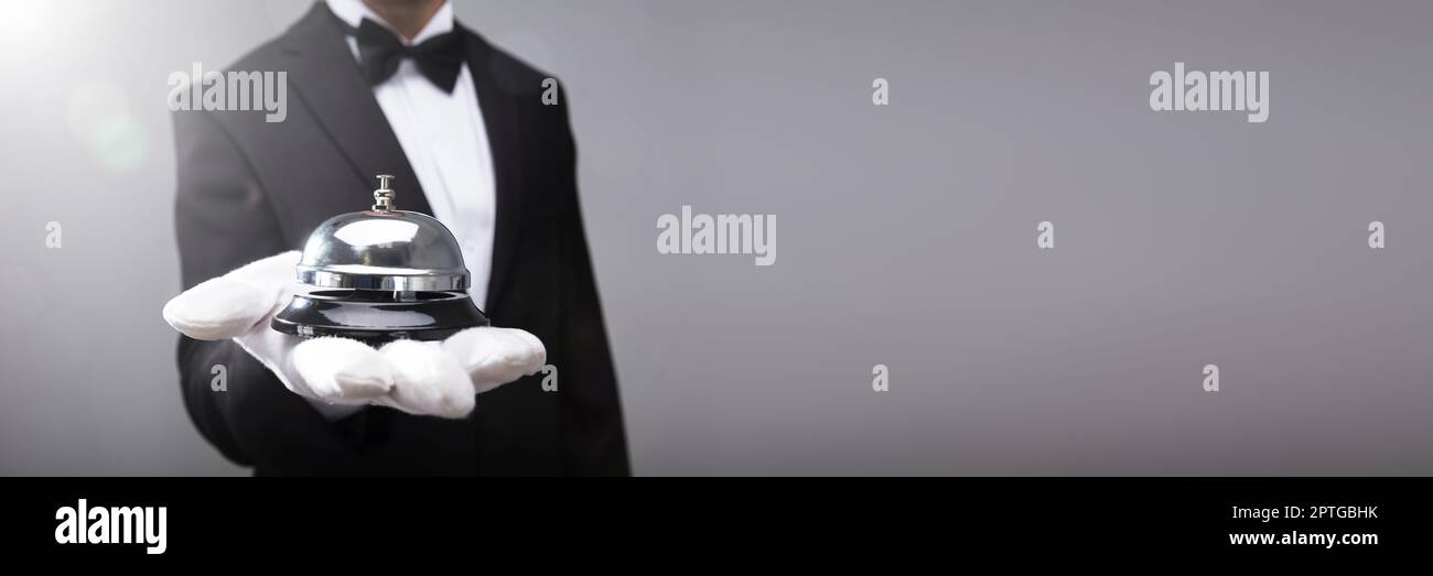 Concierge Servant With Service Bell. Luxury Waiter Stock Photo - Alamy