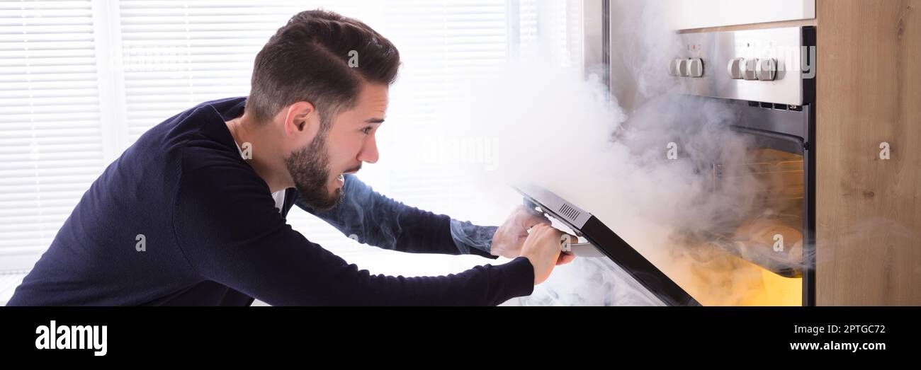 Oven Cooking Disaster. Overcook Smoke In House Stock Photo - Alamy