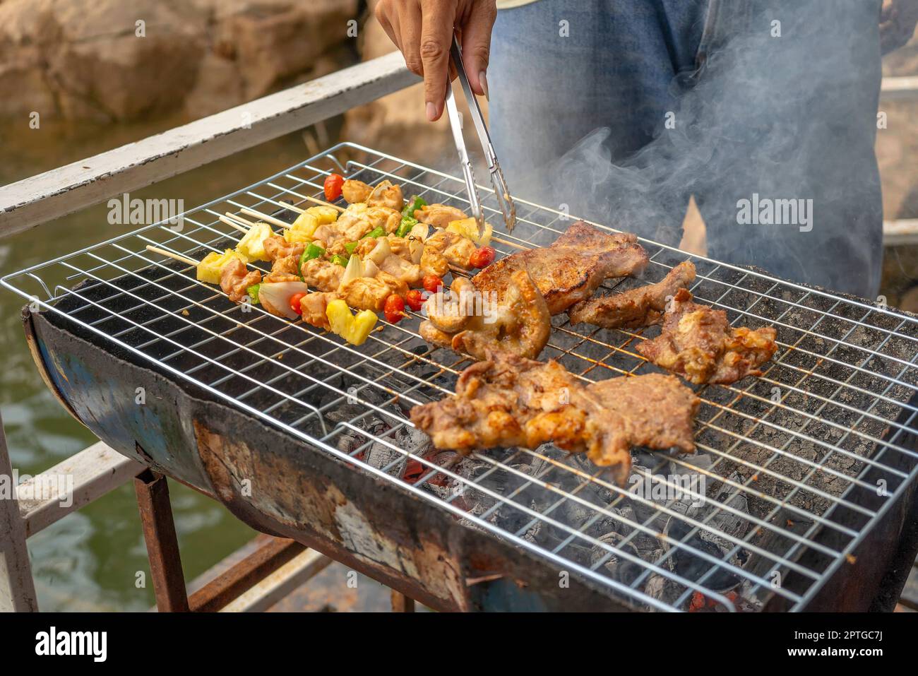 Grilled meat scorched on the grill, burnt Stock Photo - Alamy