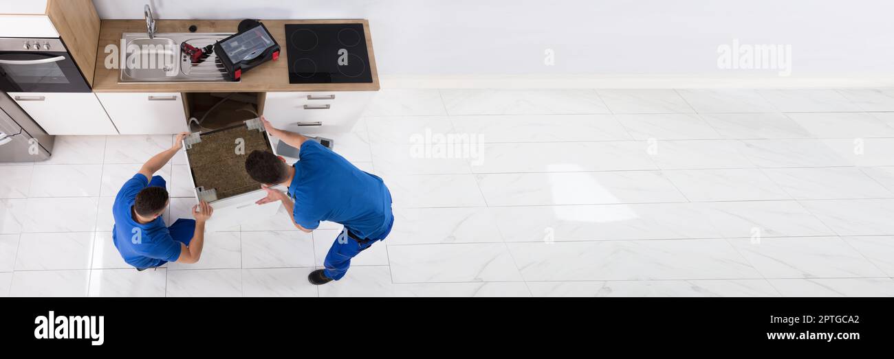 Home Dishwasher Repair Team. Professional Kitchen Mover Stock Photo - Alamy