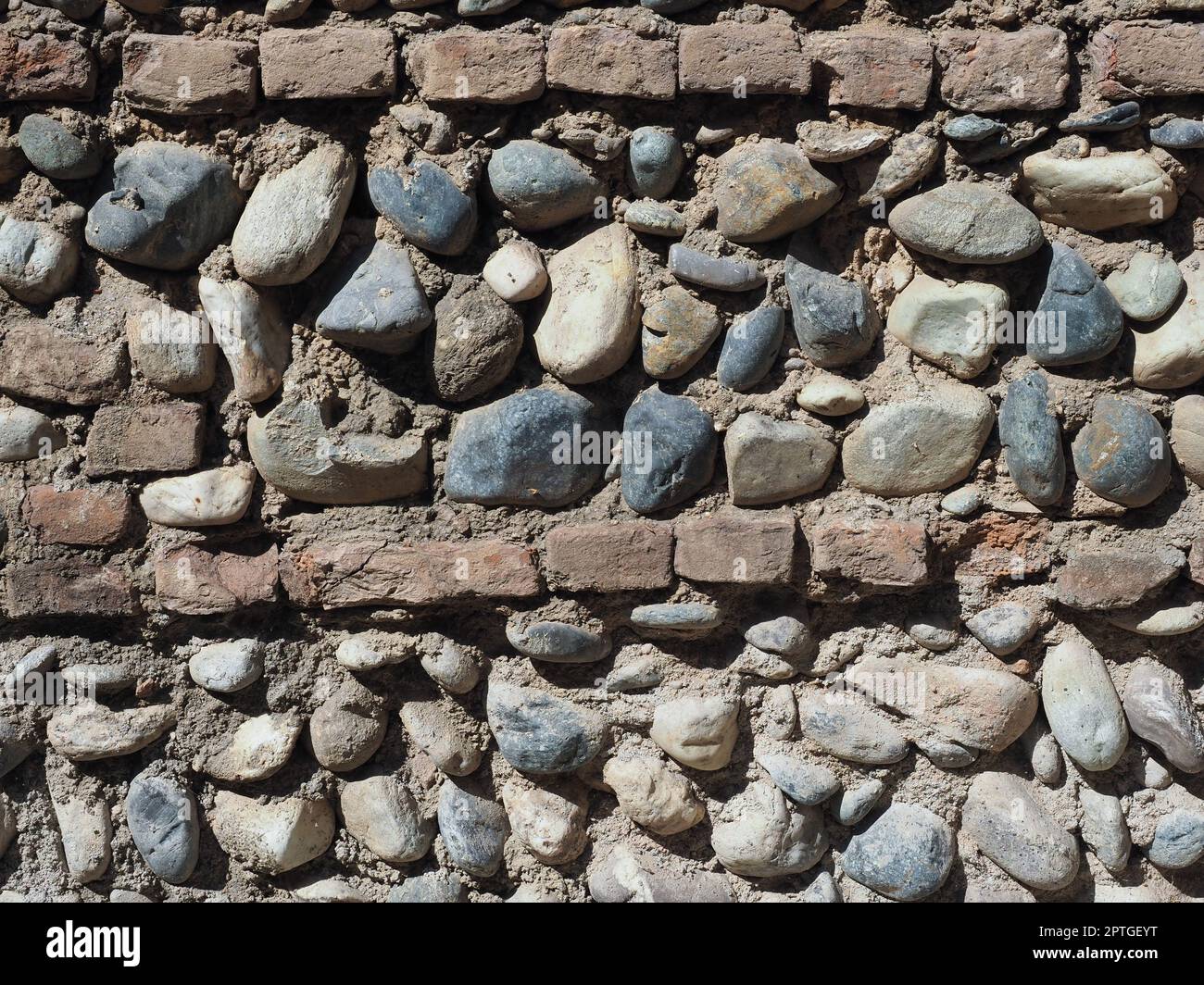 brick and stone wall useful as a background Stock Photo - Alamy