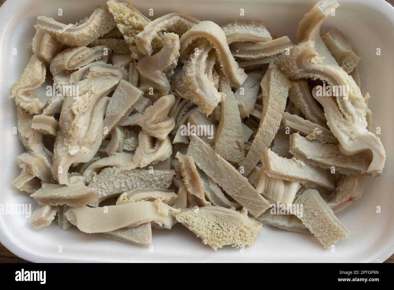 raw tripe cut into strips in a plastic tray Stock Photo - Alamy