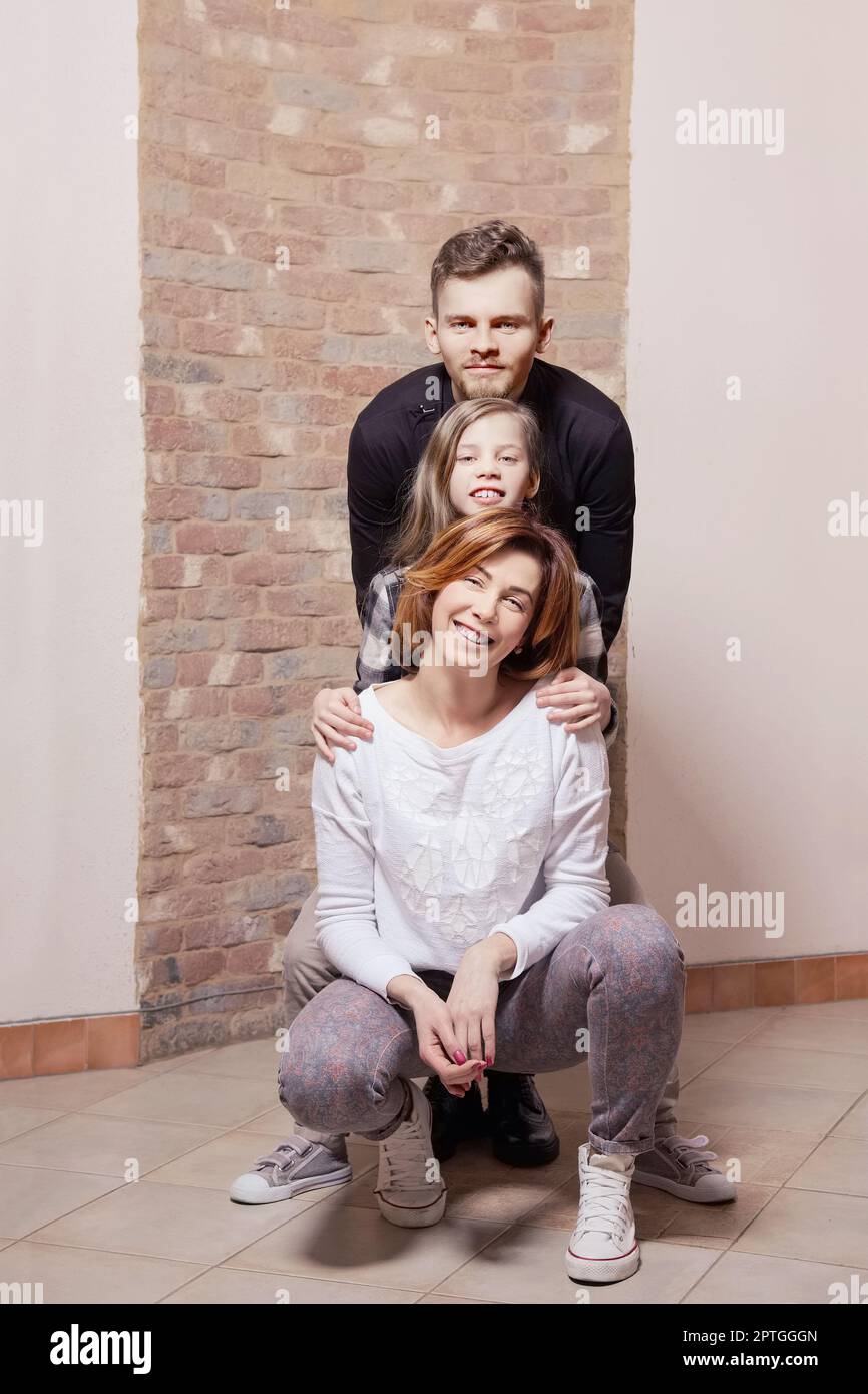 Portrait of happy family hugging each other Stock Photo - Alamy