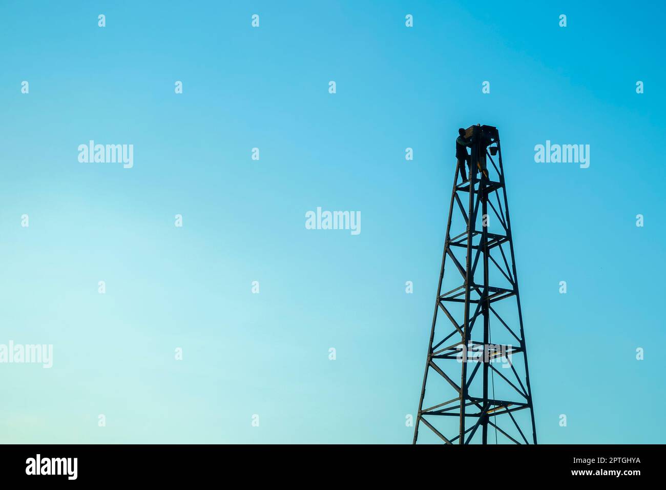 Pile rig construction worker building in evening Stock Photo - Alamy