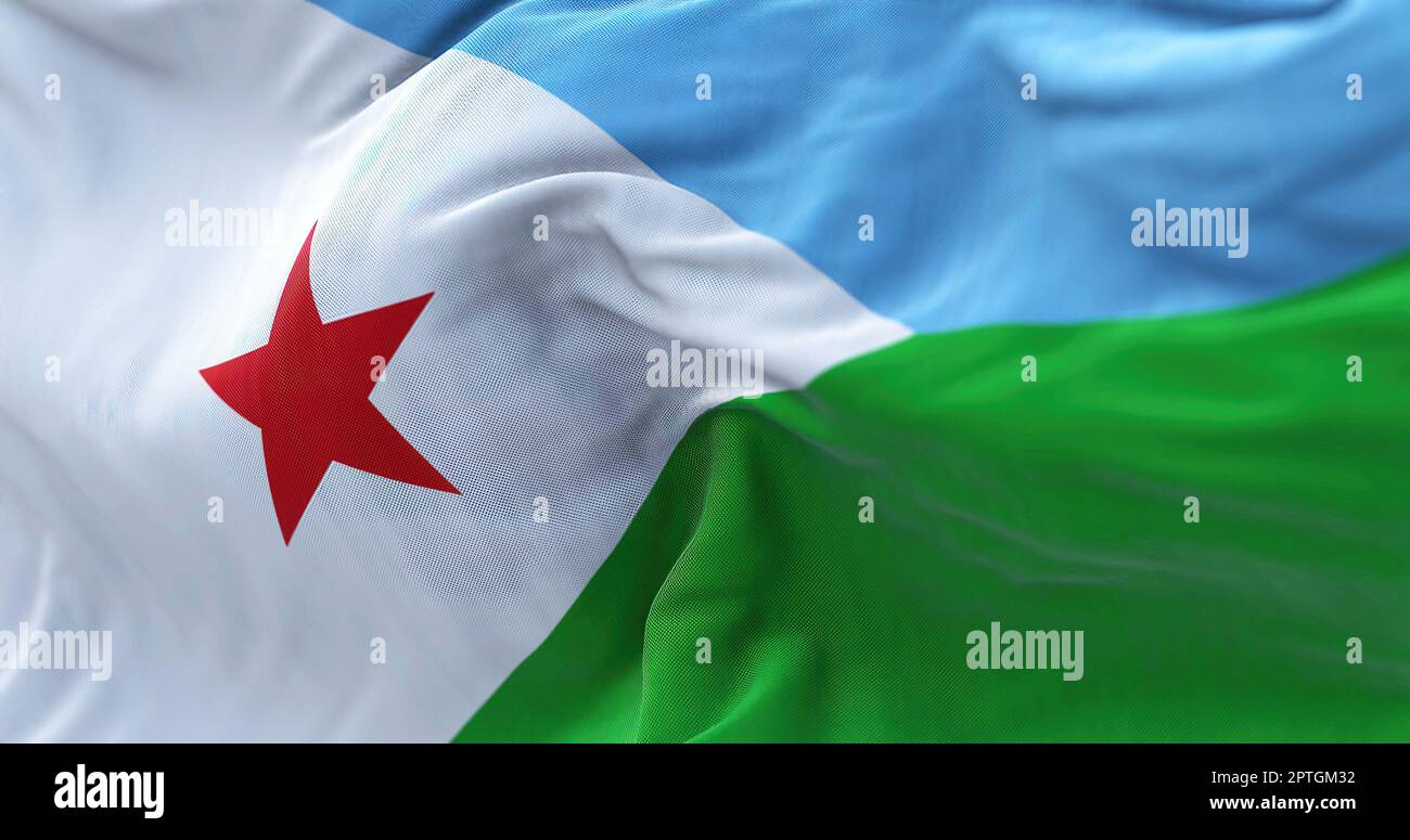 Close-up view of the Djibouti national flag waving in the wind. The ...
