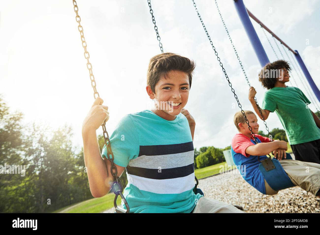 Three best buddies hanging out. Portrait of a young boy playing on a ...