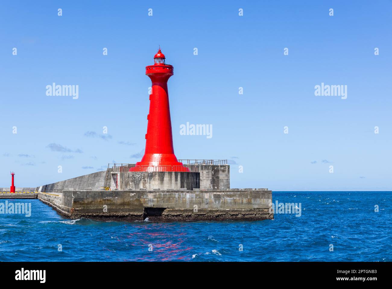 Red lighthouse over the concrete pier in Hualien harbor of Taiwan Stock ...