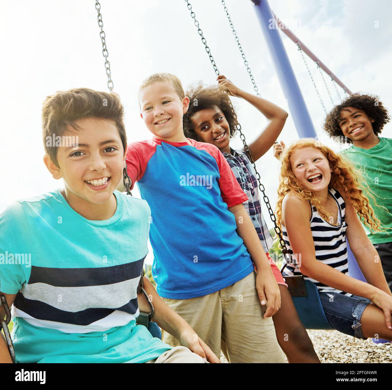 The cool kids club. a group of young children playing together at the ...