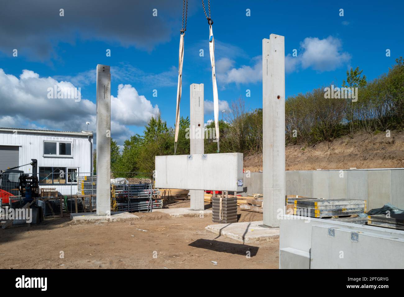 many concrete pillars for a factory building are erected on a ...