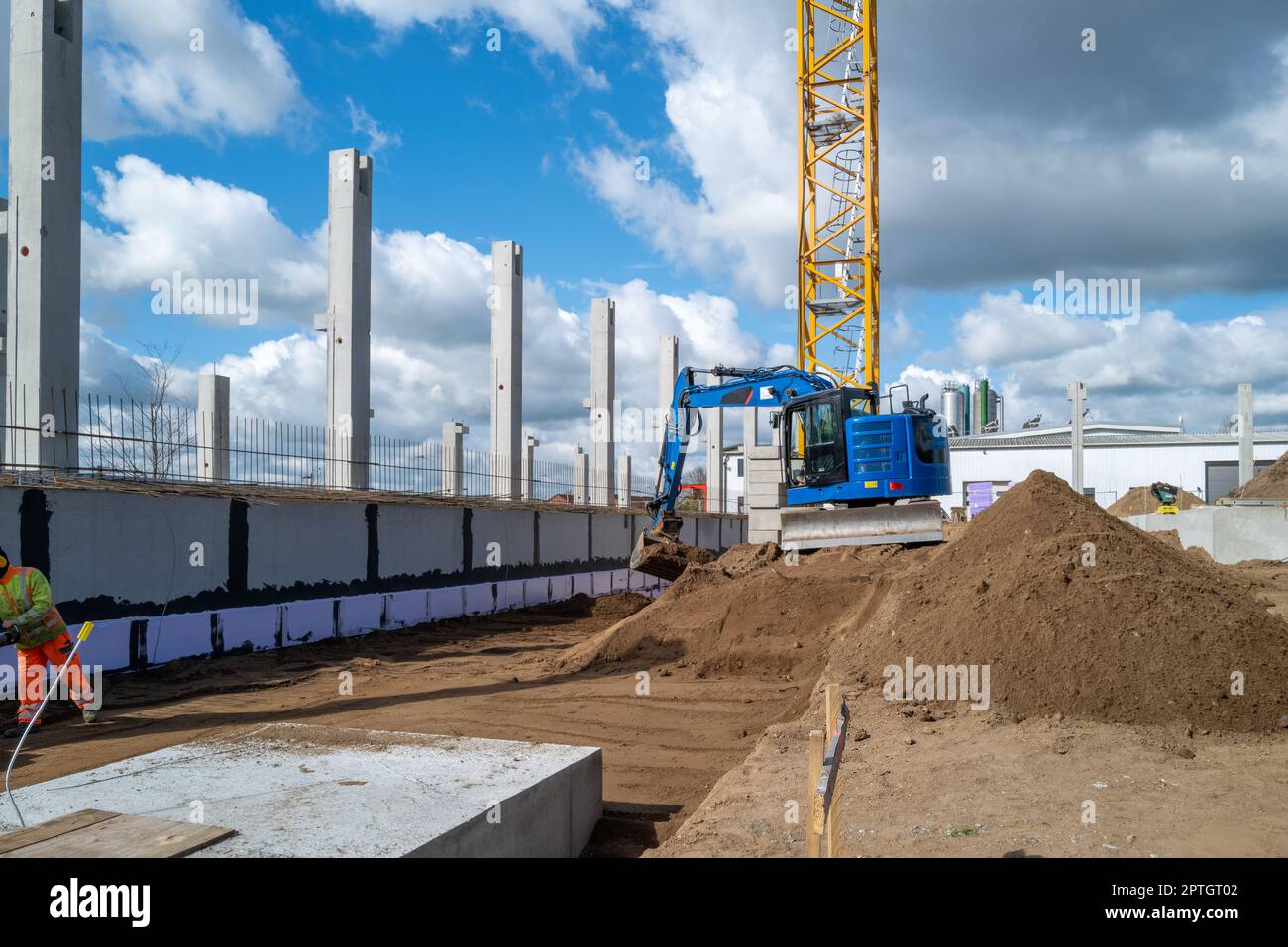 many concrete pillars for a factory building are erected on a ...