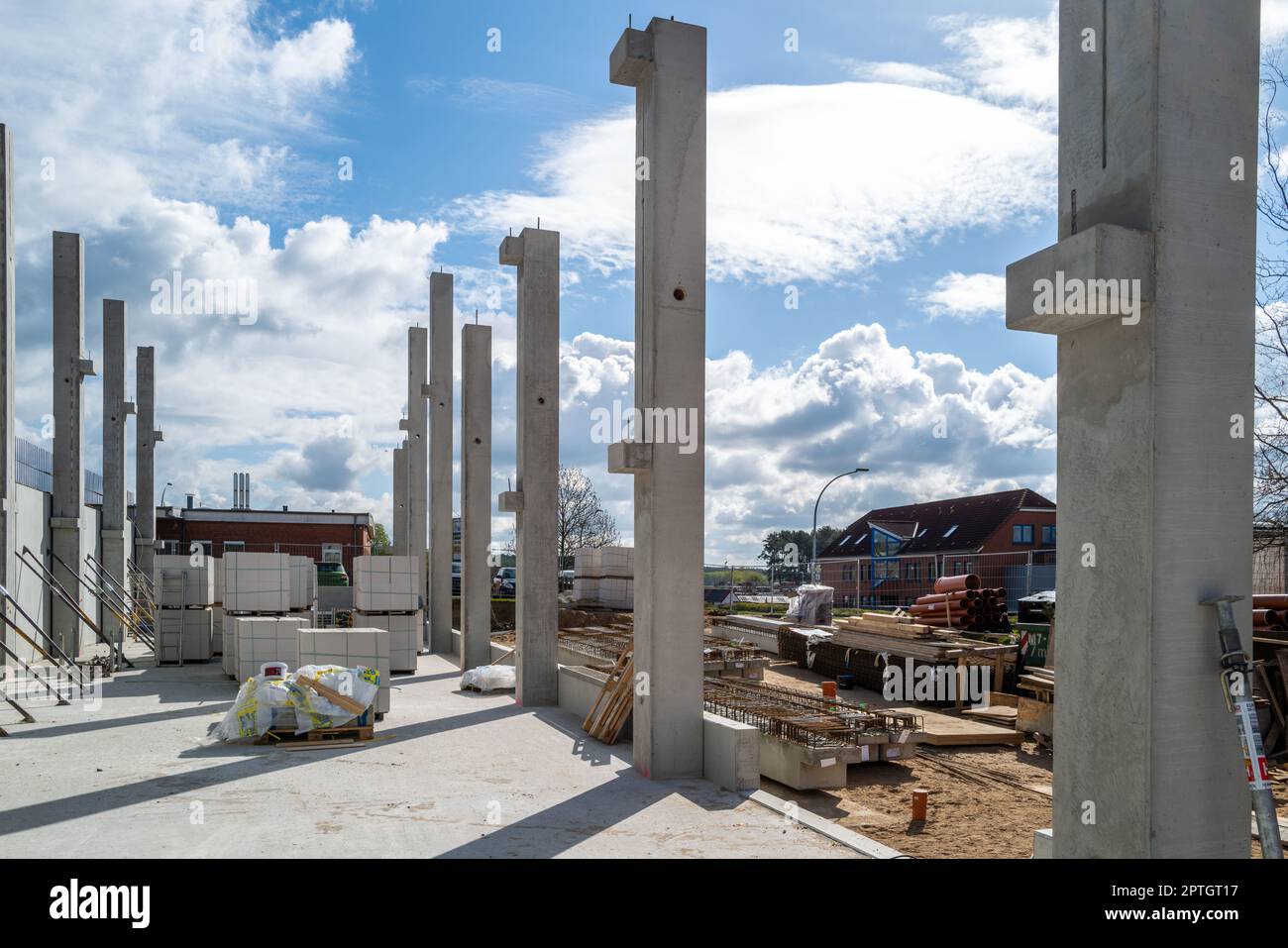 many concrete pillars for a factory building are erected on a ...