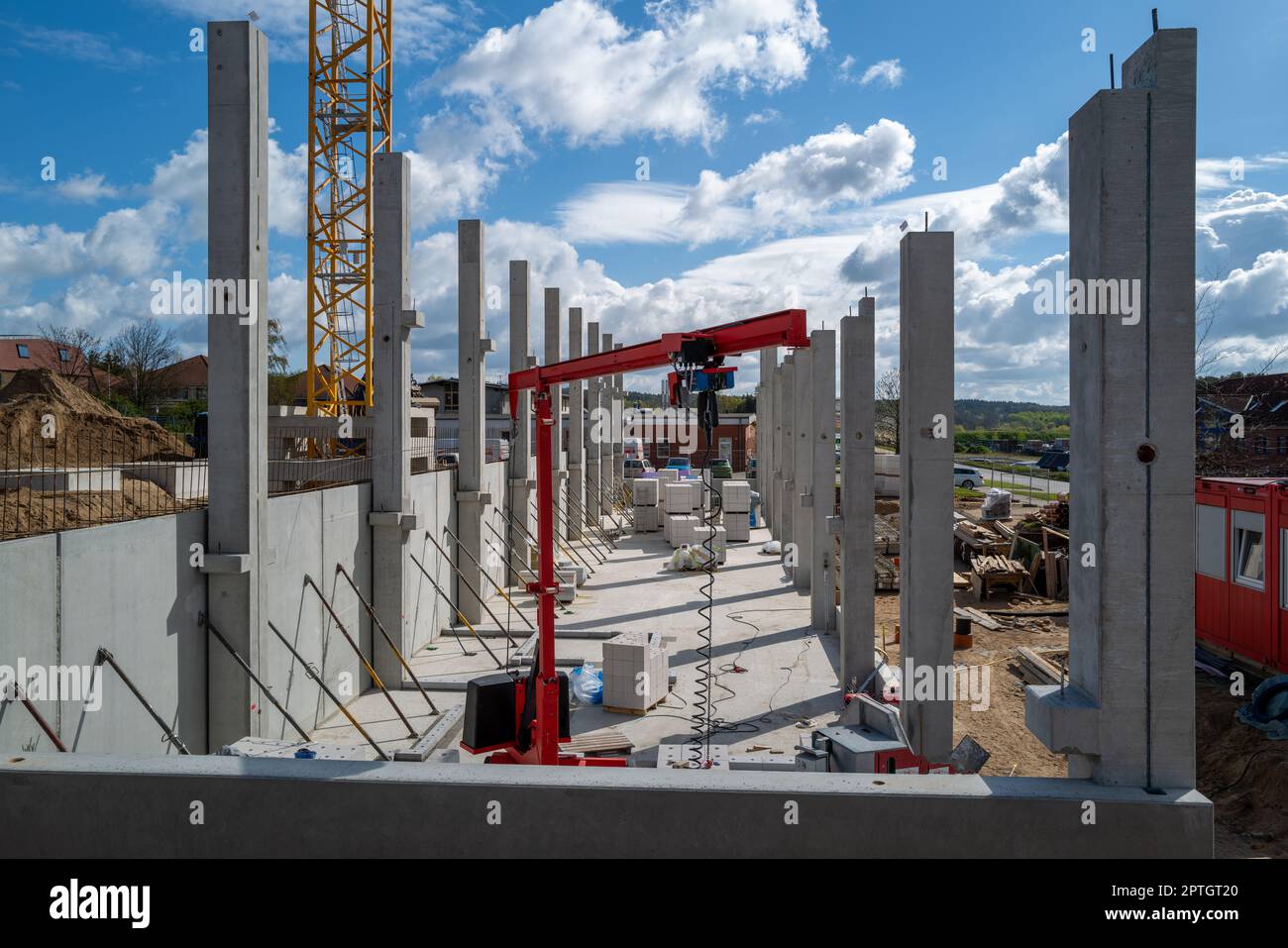 many concrete pillars for a factory building are erected on a ...