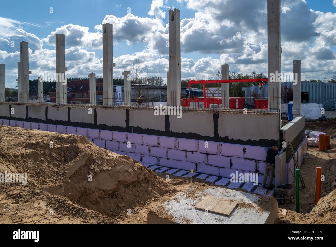 many concrete pillars for a factory building are erected on a ...