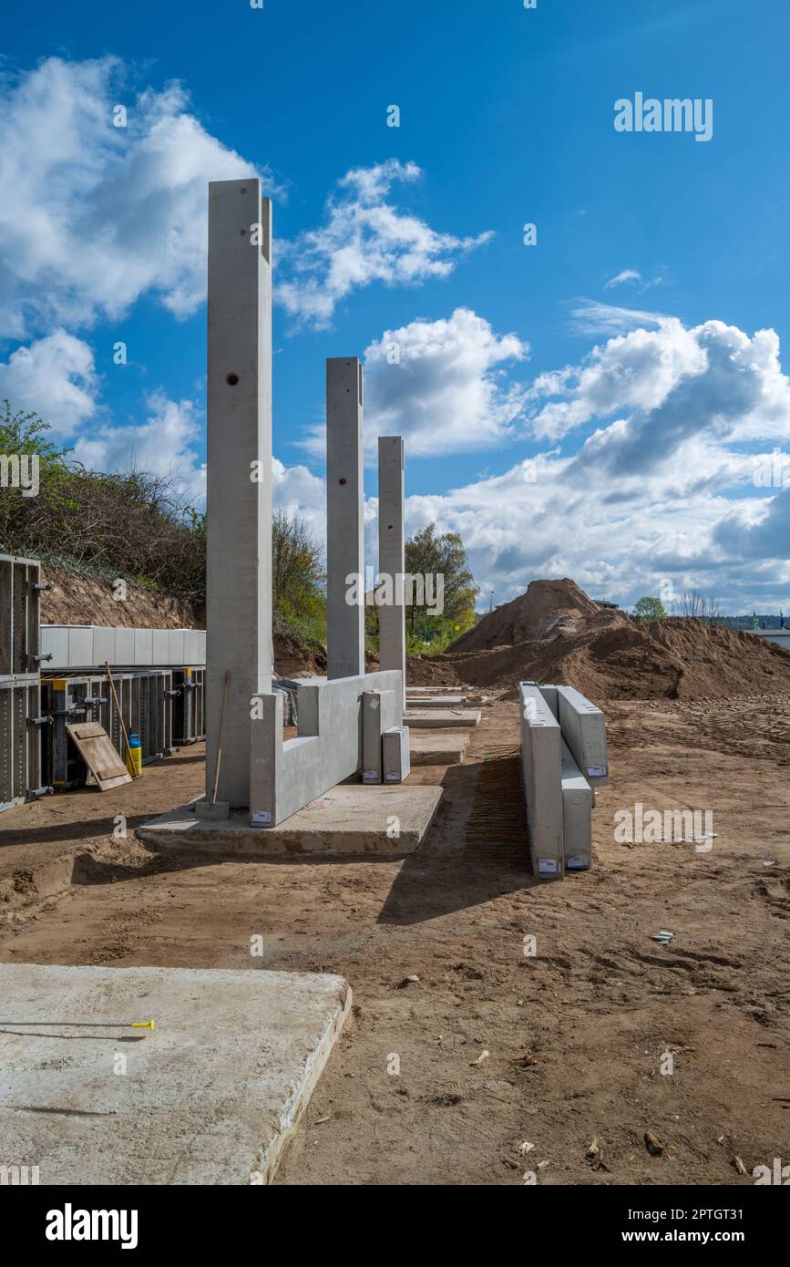 many concrete pillars for a factory building are erected on a ...