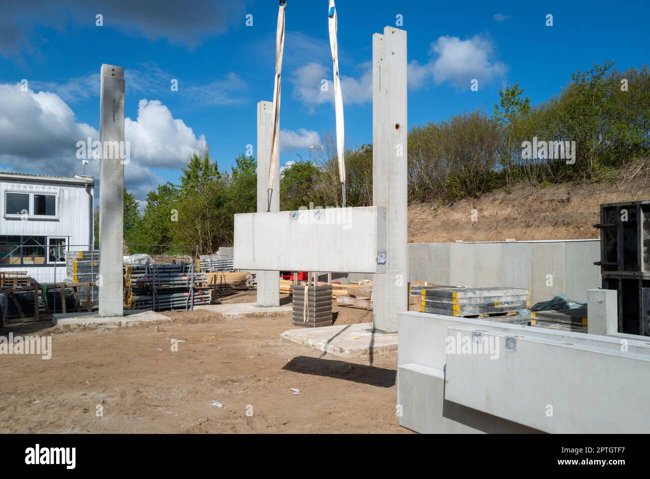 many concrete pillars for a factory building are erected on a ...