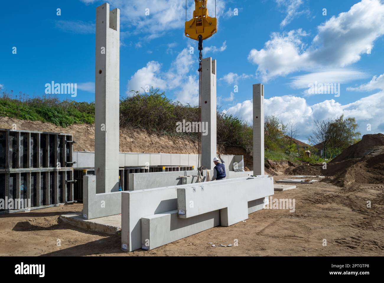 many concrete pillars for a factory building are erected on a ...