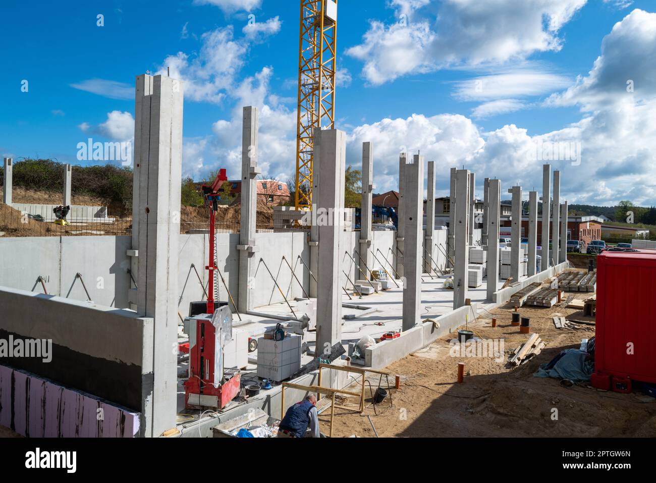 many concrete pillars for a factory building are erected on a ...