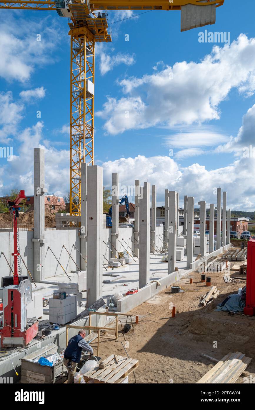 many concrete pillars for a factory building are erected on a ...