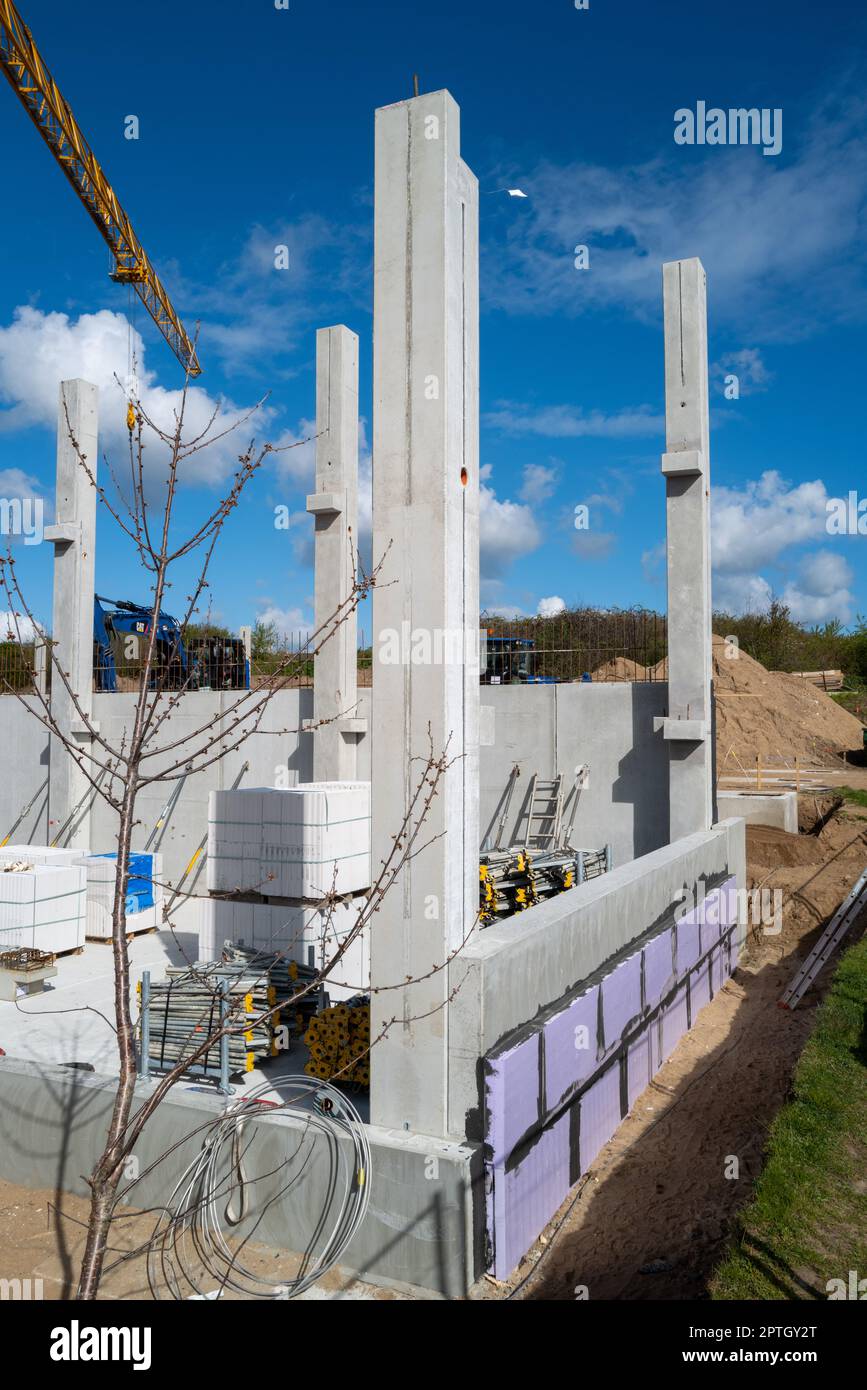 many concrete pillars for a factory building are erected on a ...