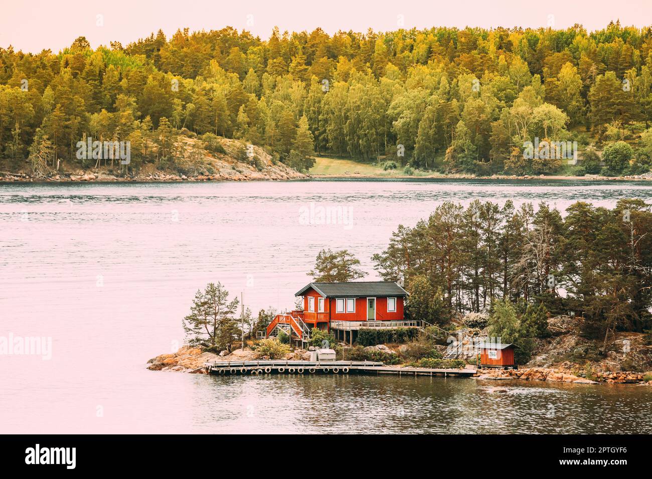 Sweden. Many Beautiful Red Swedish Wooden Log Cabin House On Rocky ...