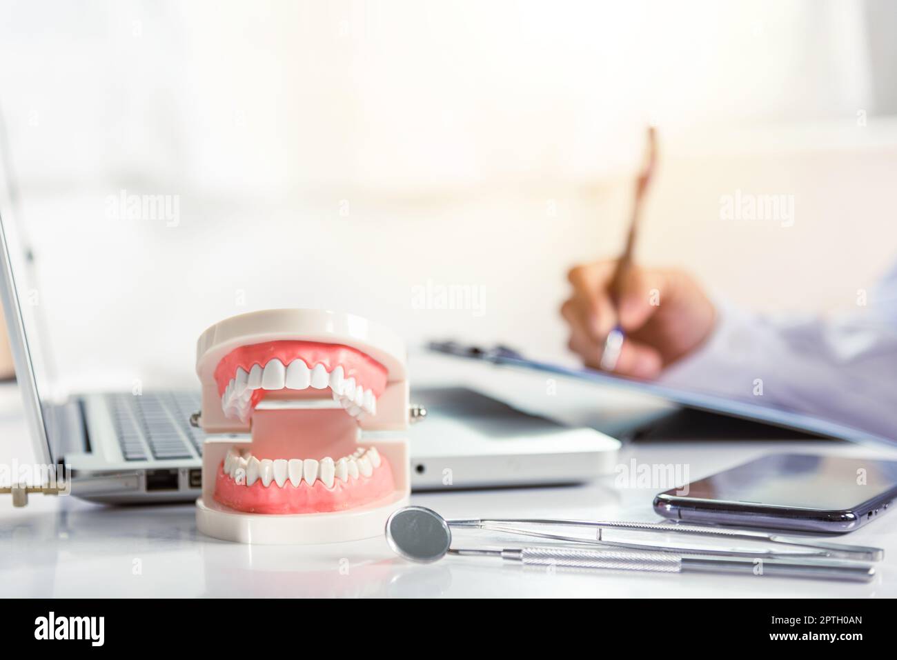 Oral dental. Dentist doctor in uniform writing information of patient ...